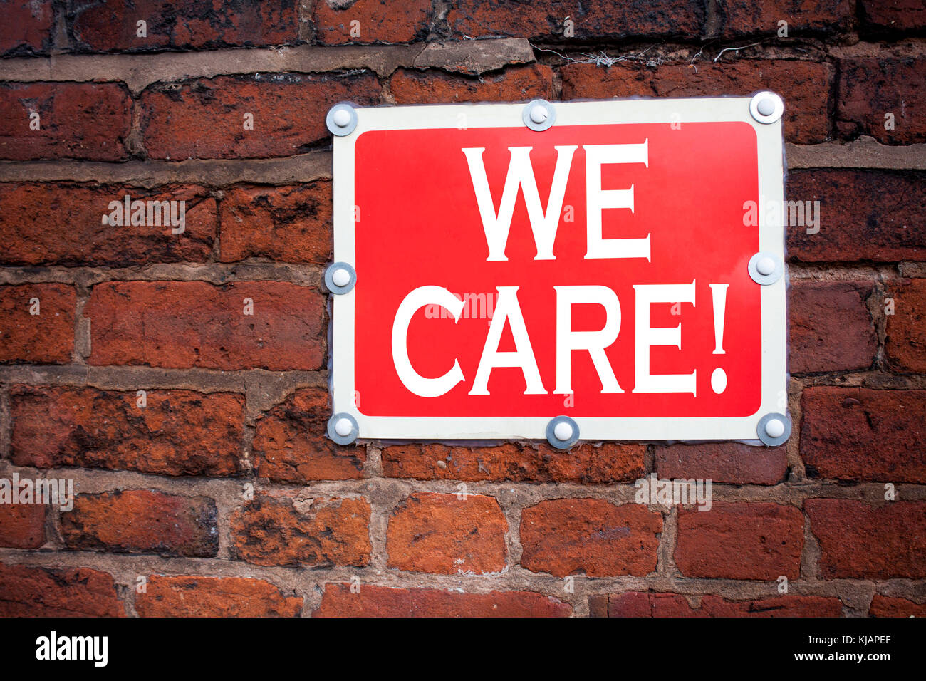 Hand writing text caption inspiration showing We Care concept meaning ...