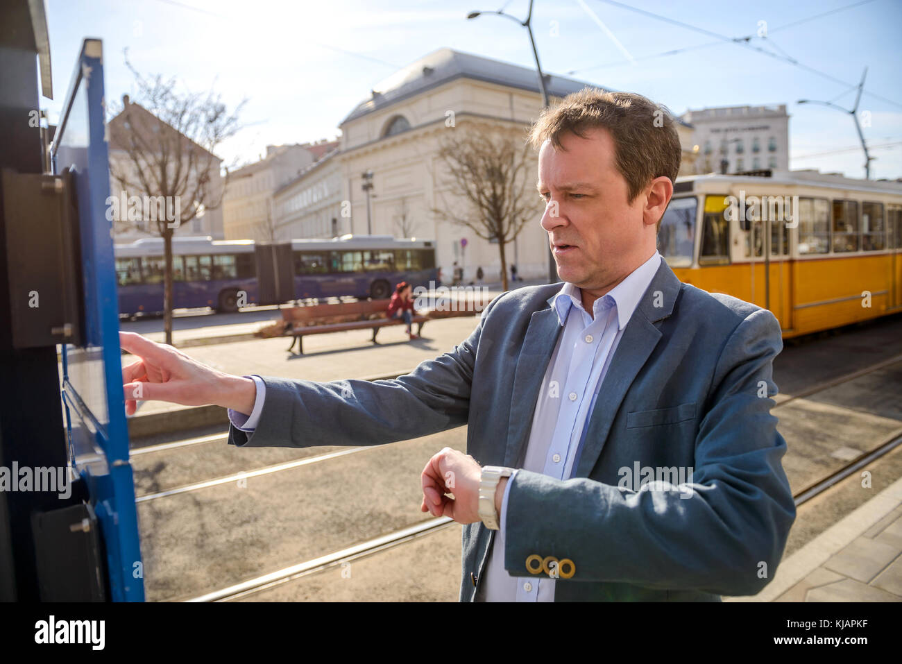People watching timetable hi-res stock photography and images - Alamy