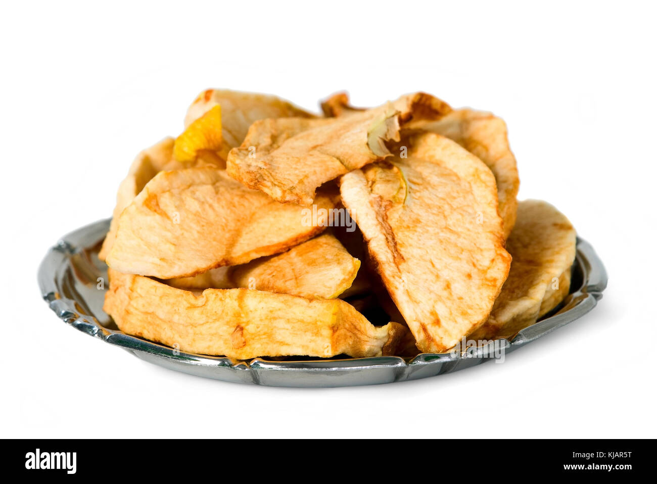 Sliced dry apples for snacks on white background Stock Photo - Alamy