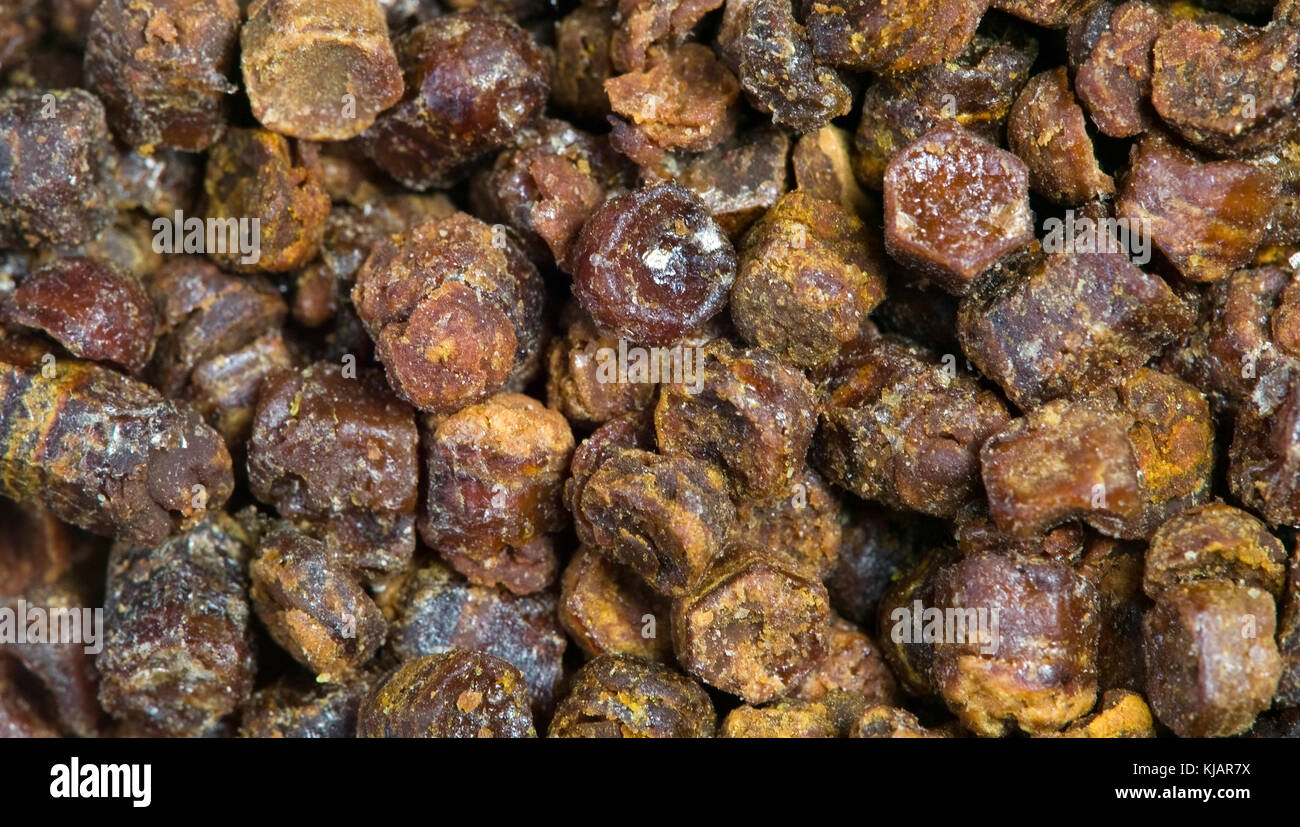 Propolis granules grunge texture background, bee product Stock Photo ...