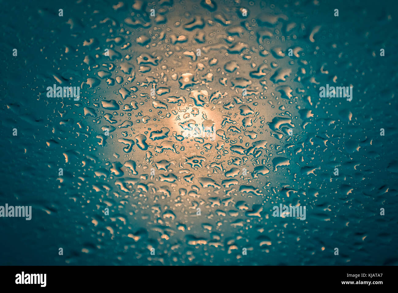 View the moon through a wet window Stock Photo - Alamy