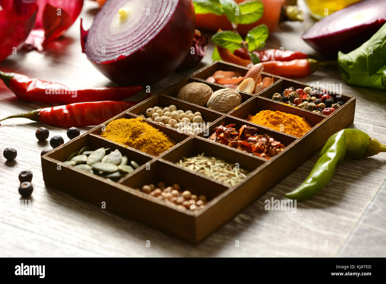 assorted spices in wooden container - closeup Stock Photo - Alamy