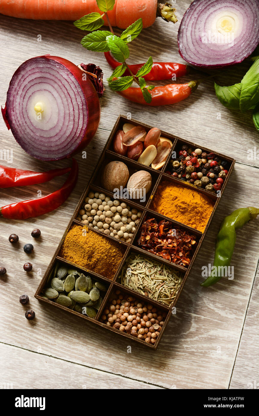assorted spices in wooden container - closeup Stock Photo - Alamy