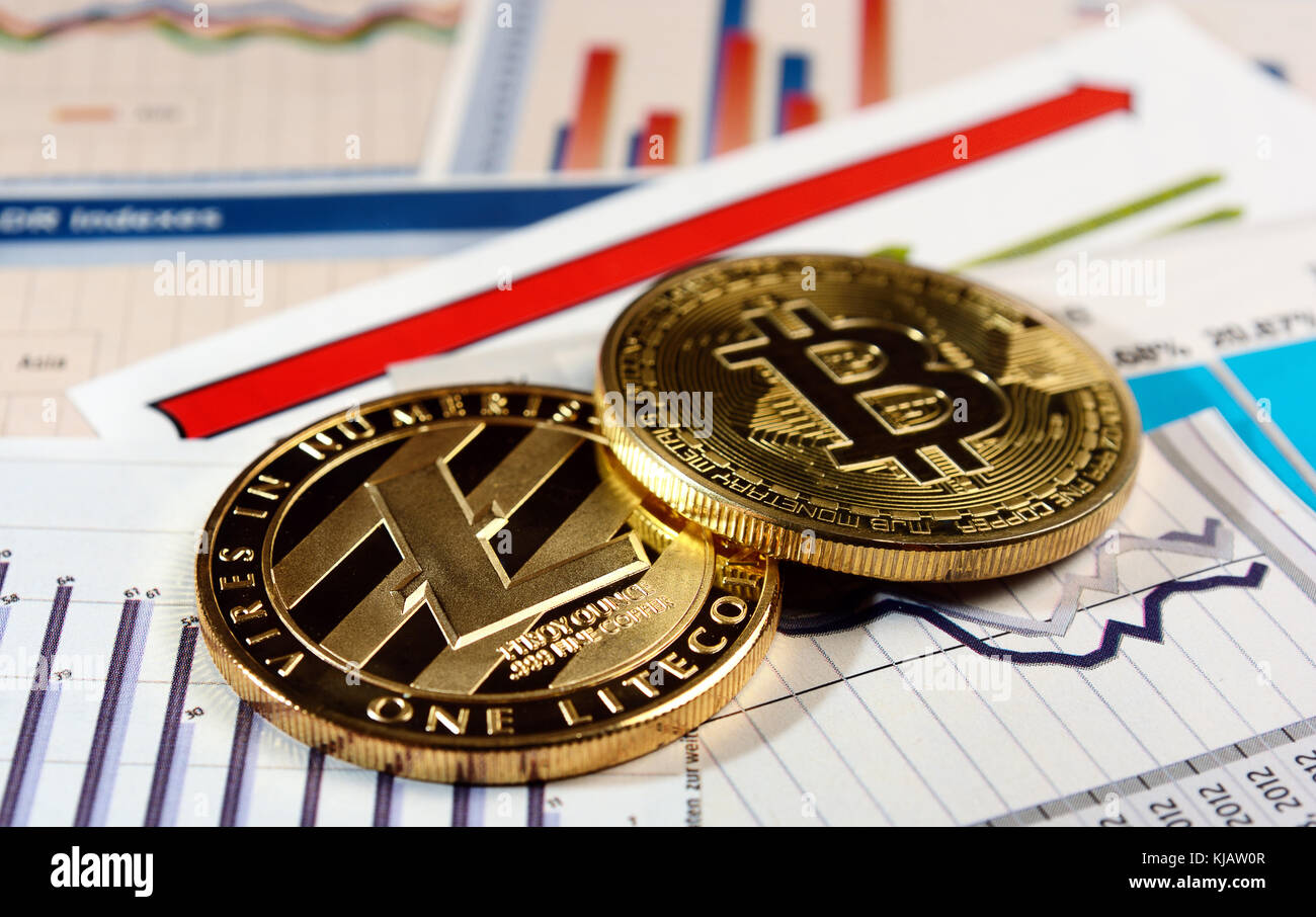 A golden bitcoin and litecoin on graph and diagrams background. concept ...