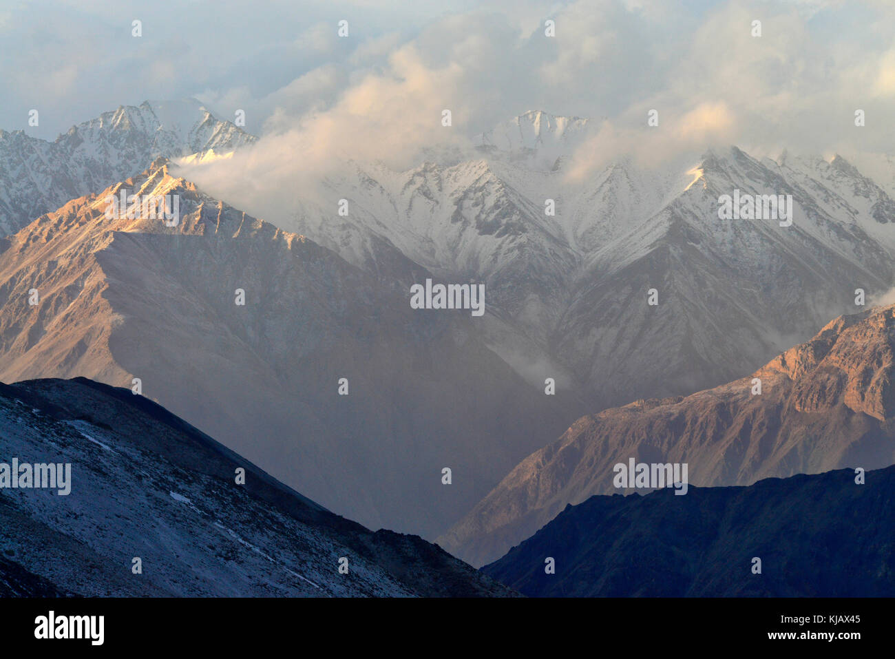 High mountains: chains of ridges rise upward, peaks are covered with ...
