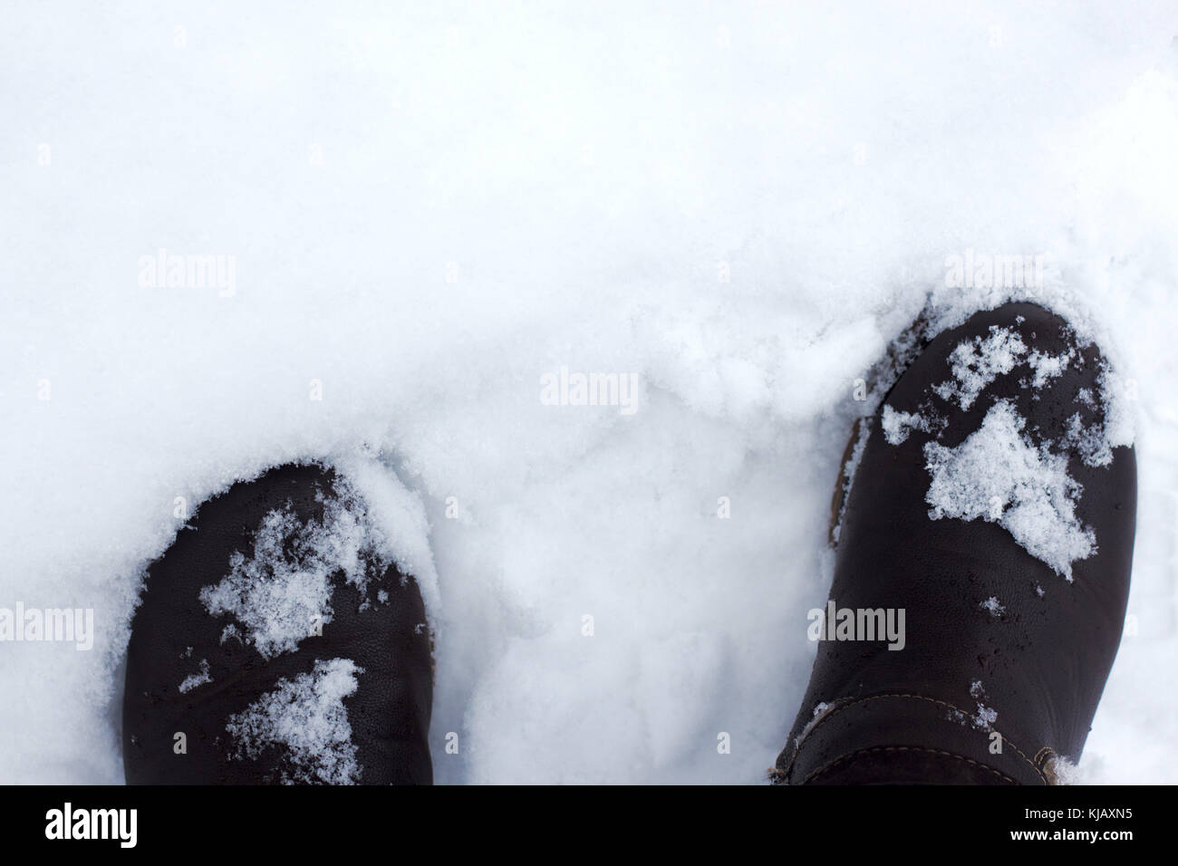 Boots in the snow hi-res stock photography and images - Alamy