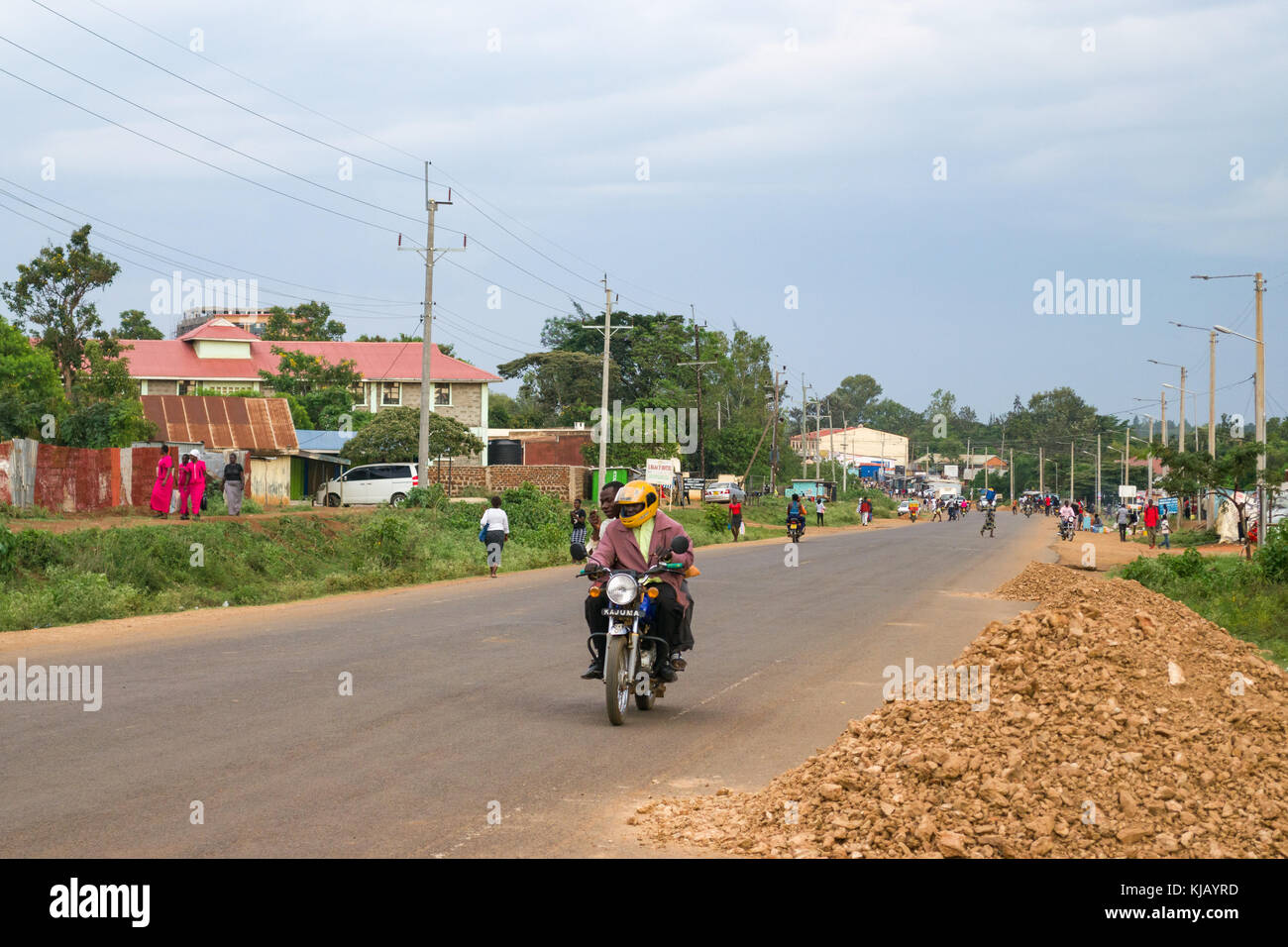 Main road running through Bondo town in Western Kenya with people and ...