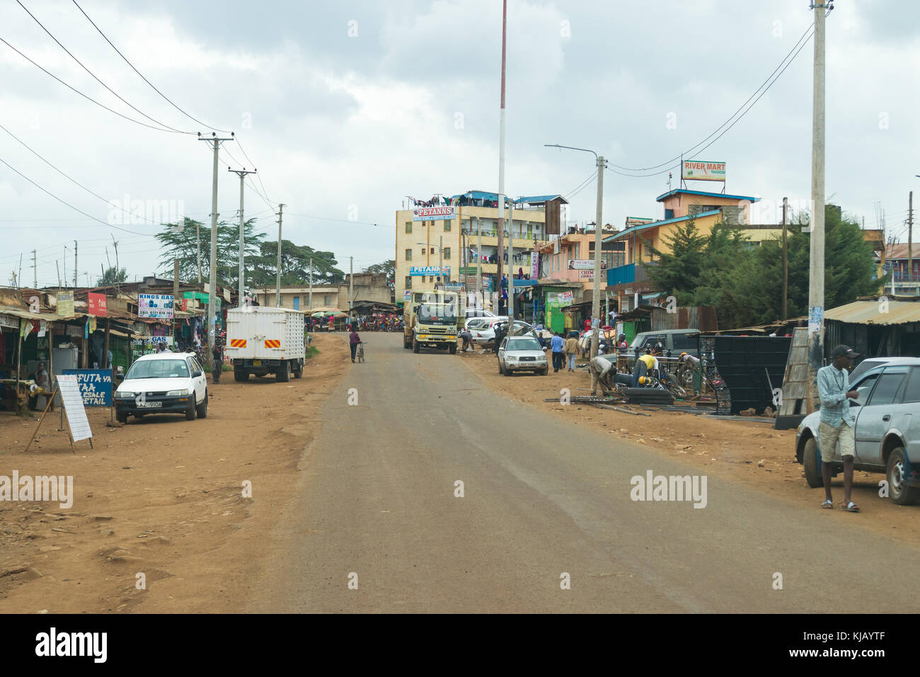 Gachie town main road with people and buildings lined along it, Kenya ...