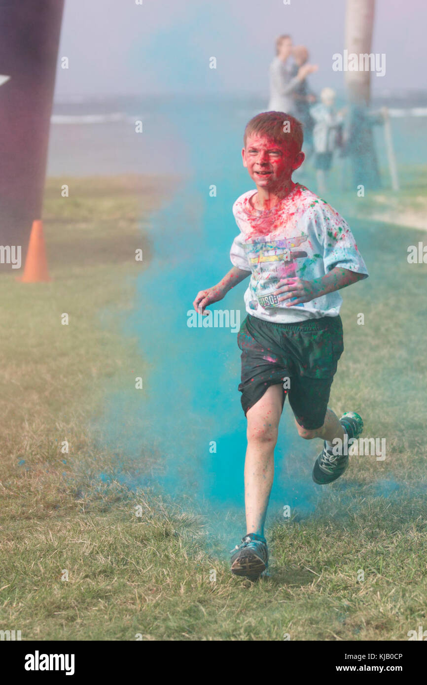 TORII STATION, OKINAWA, Japan – A child finishes the 5th Annual USO ...