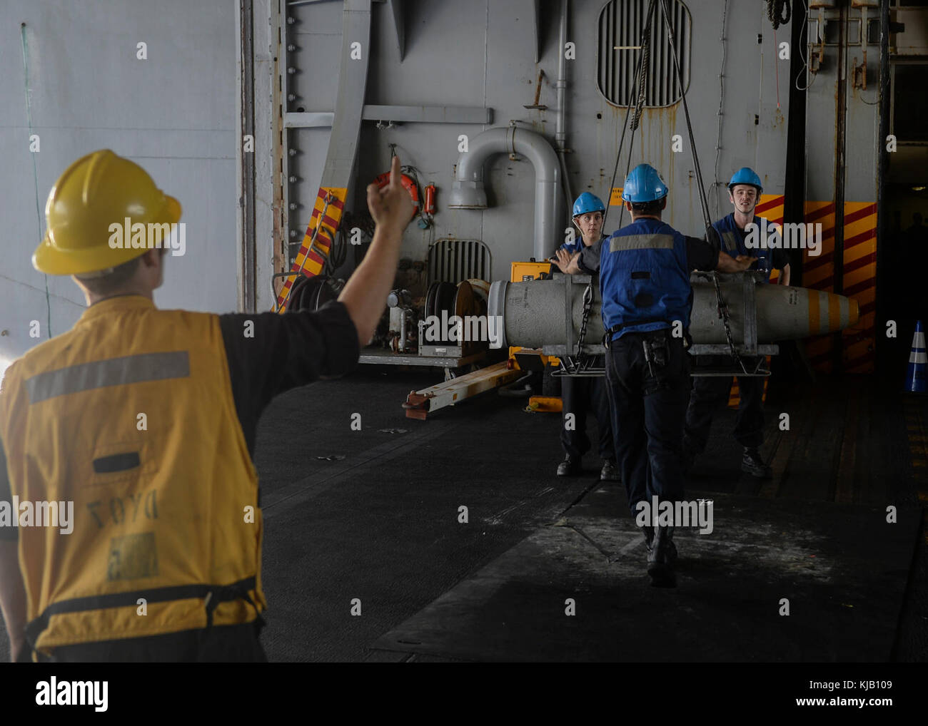 PACIFIC OCEAN (Nov. 21, 2017) U.S. Navy Sailors load ordnance during an ...