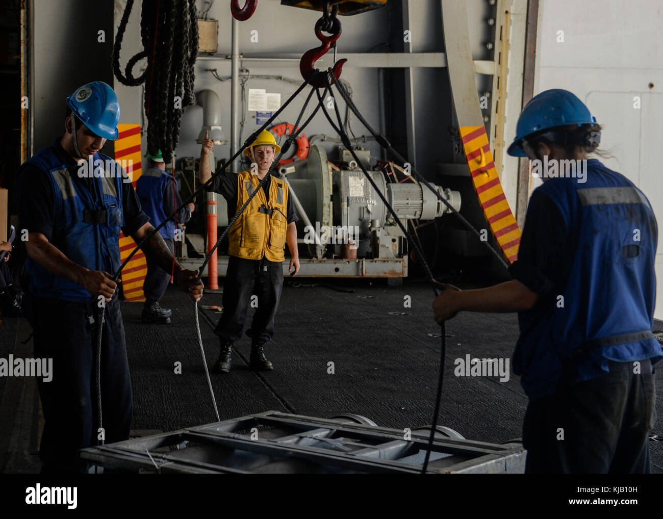 PACIFIC OCEAN (Nov. 21, 2017) U.S. Navy Sailors load ordnance during an ...