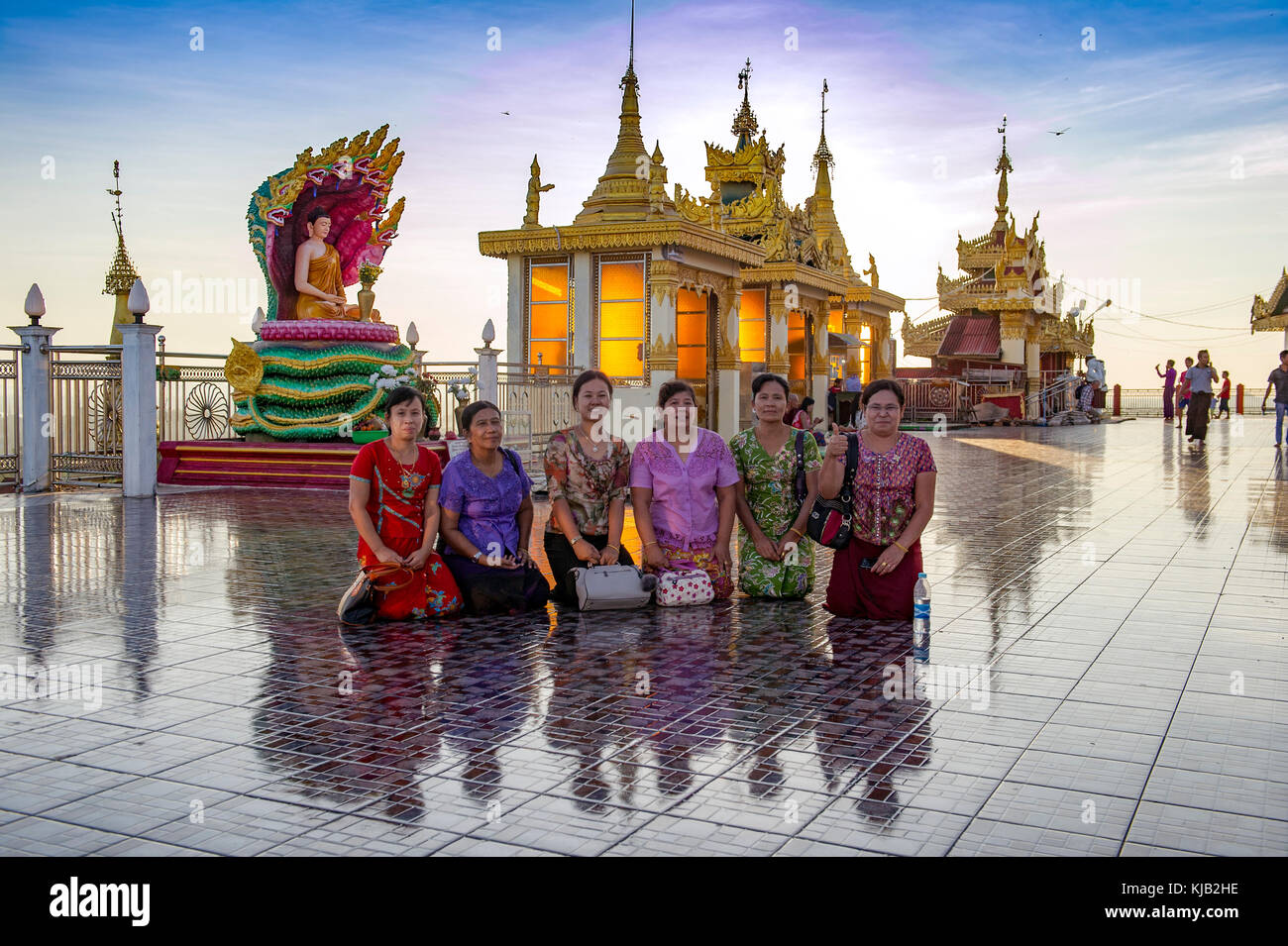 Myanmar. Mon State. Mawlamyine (Moulmein). Women posing at Pagoda Paya ...