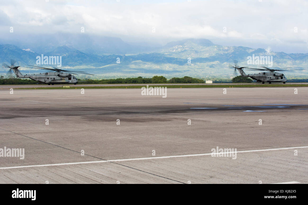 Two U.S. Marine Corps CH-53E Super Stallion helicopters with the ...