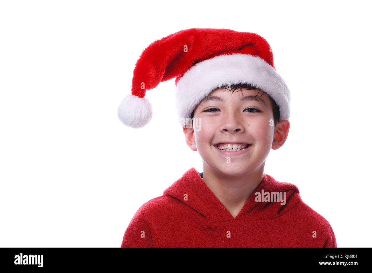Portrait of a boy wearing a santa hat smiling hi-res stock photography ...