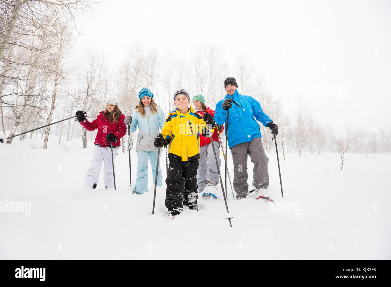 Portrait of smiling Caucasian family snowshoeing Stock Photo - Alamy