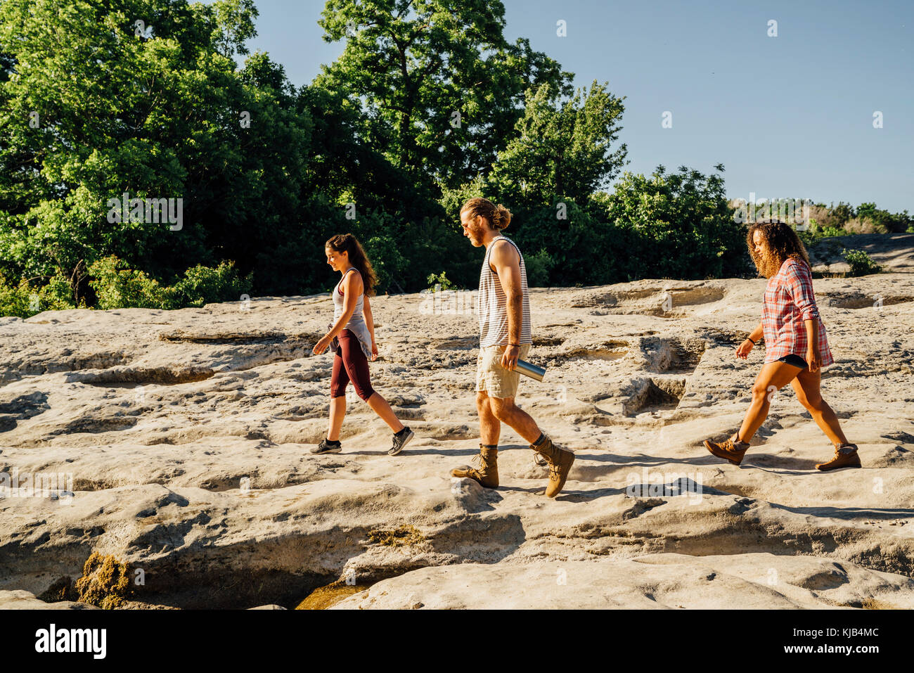 Friends walking on rocks Stock Photo - Alamy