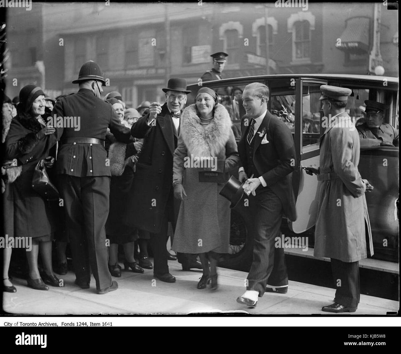 Flora McCrae Eaton and son John David Eaton exiting vehicle at opening ...