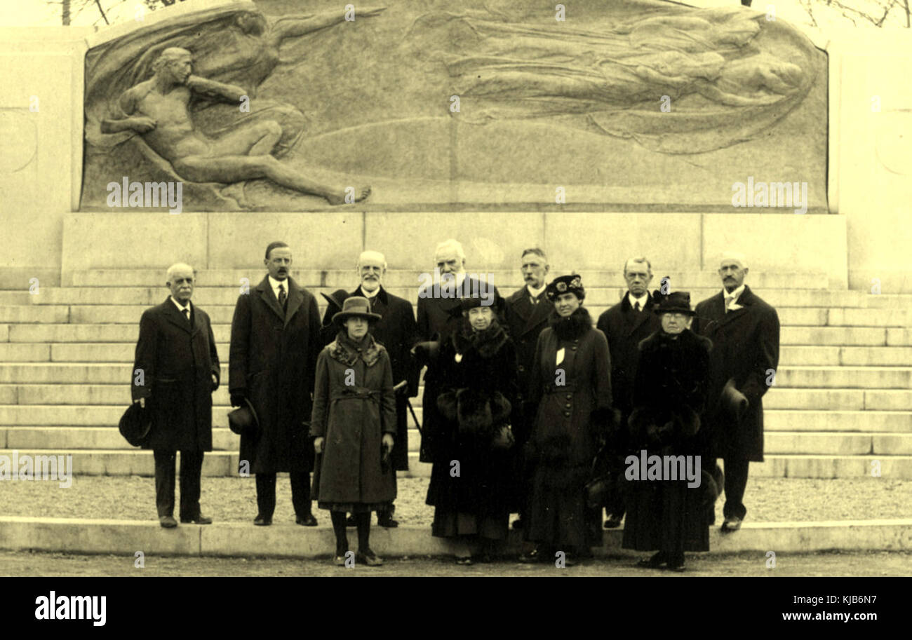 This image features the Bell family gathered at a memorial, with ...