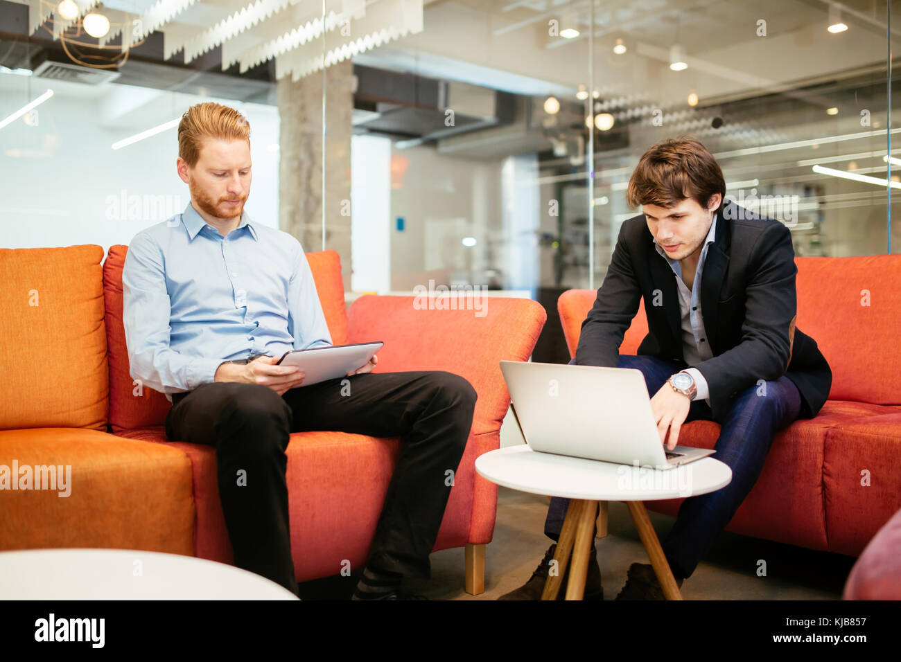Business colleagues resting during break Stock Photo - Alamy