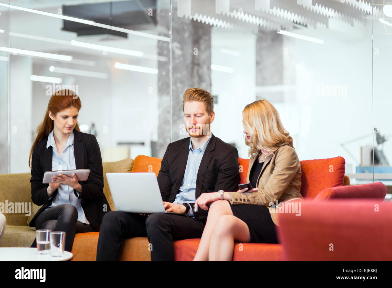 Business people conversation. Technology at hand Stock Photo - Alamy