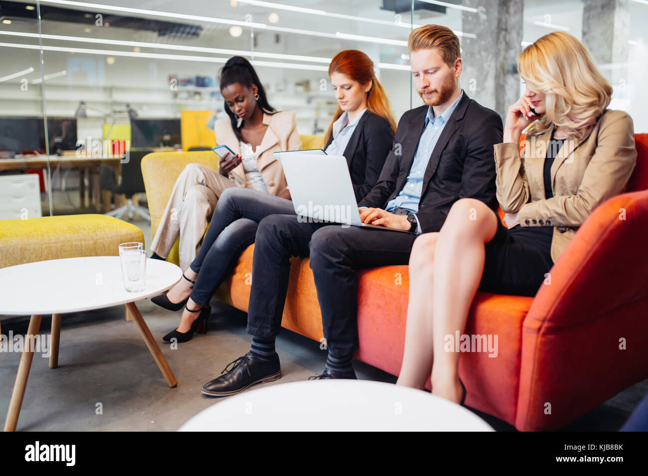 Business people conversation. Technology at hand Stock Photo - Alamy