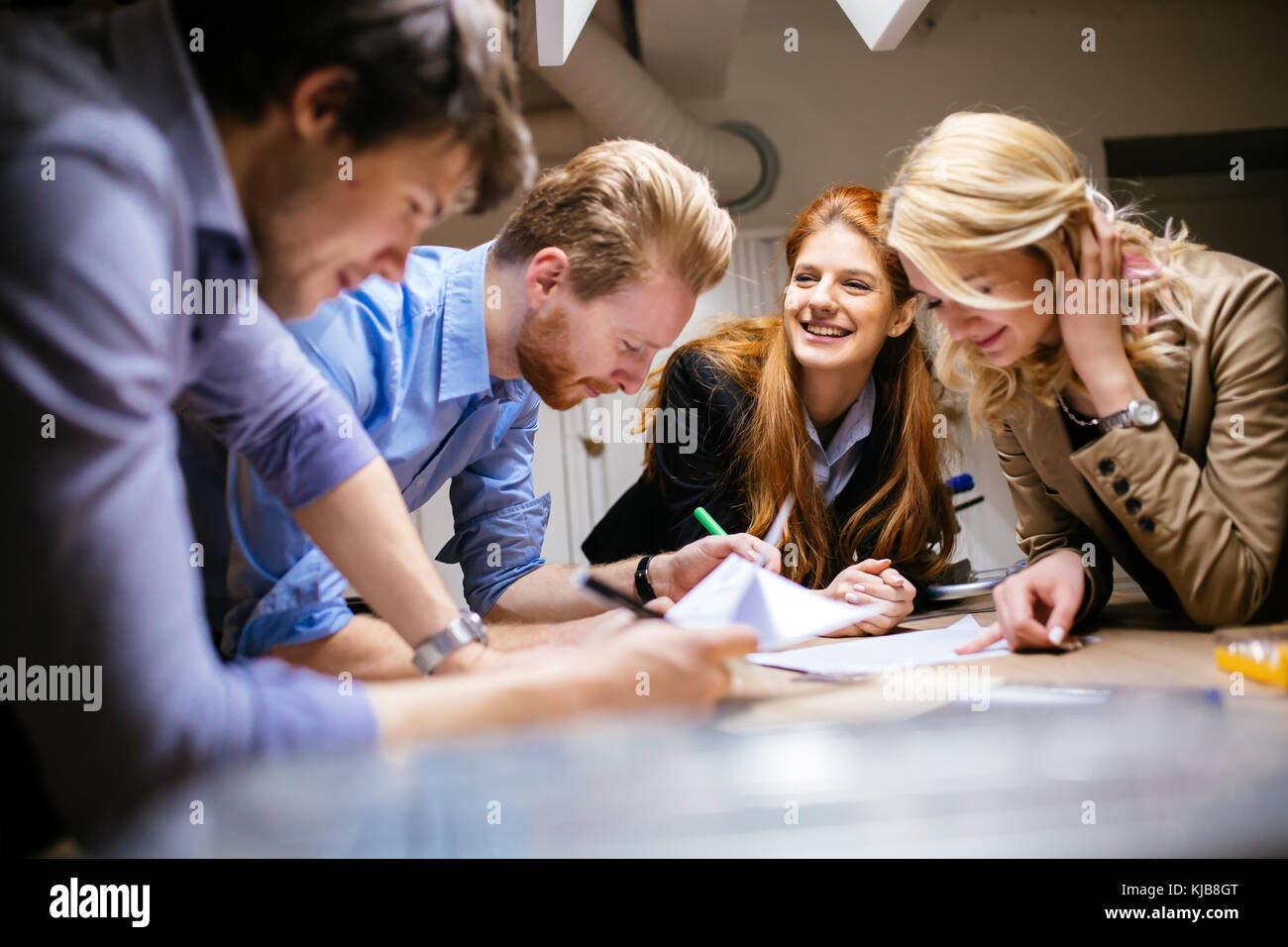 Team working on project together Stock Photo - Alamy