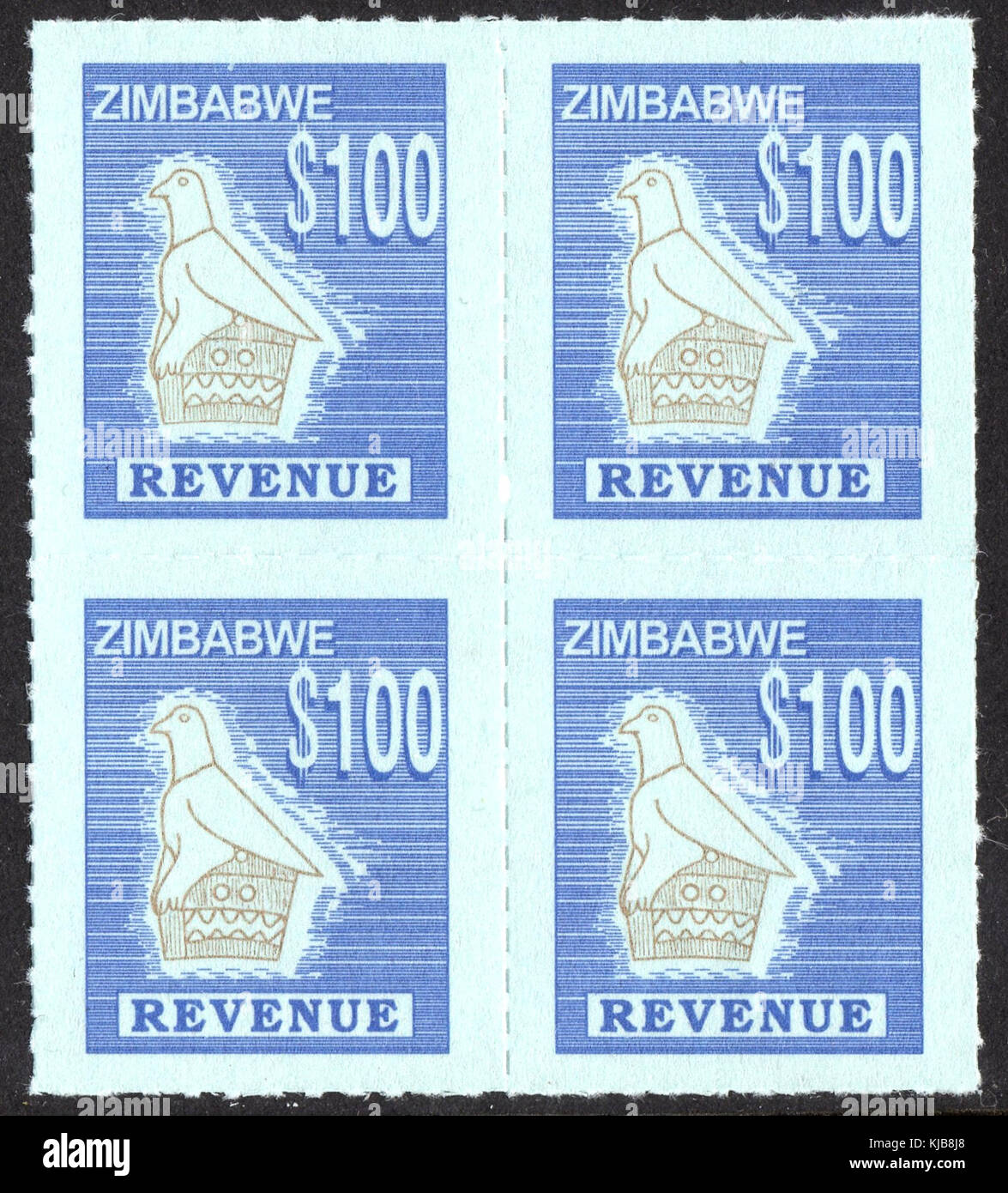 $100 Zimbabwe revenue stamps in block of four Stock Photo - Alamy