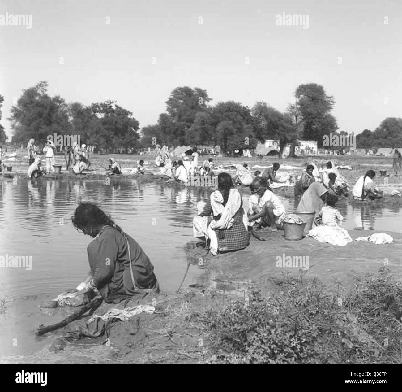 Indian villagers bathing in a stream in December 1947 (02 Stock Photo ...