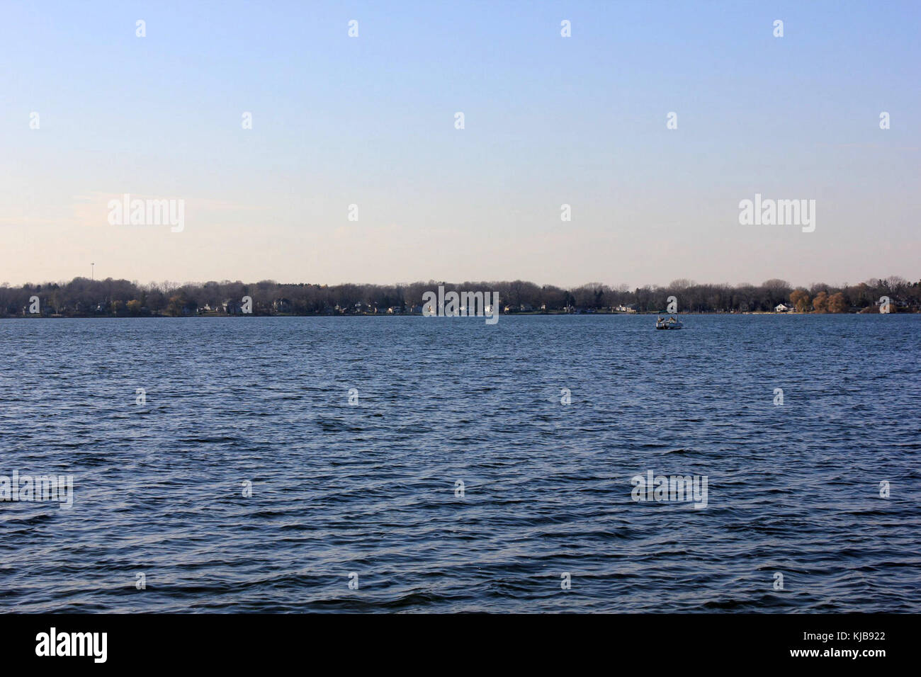 This image shows the picturesque view across Pike Lake in Wisconsin ...