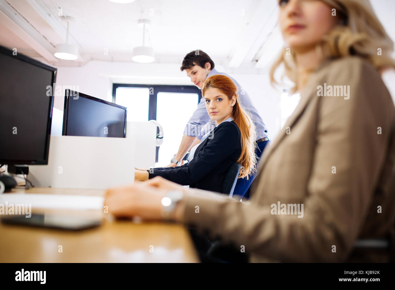 Businesswoman using computer in office Stock Photo - Alamy