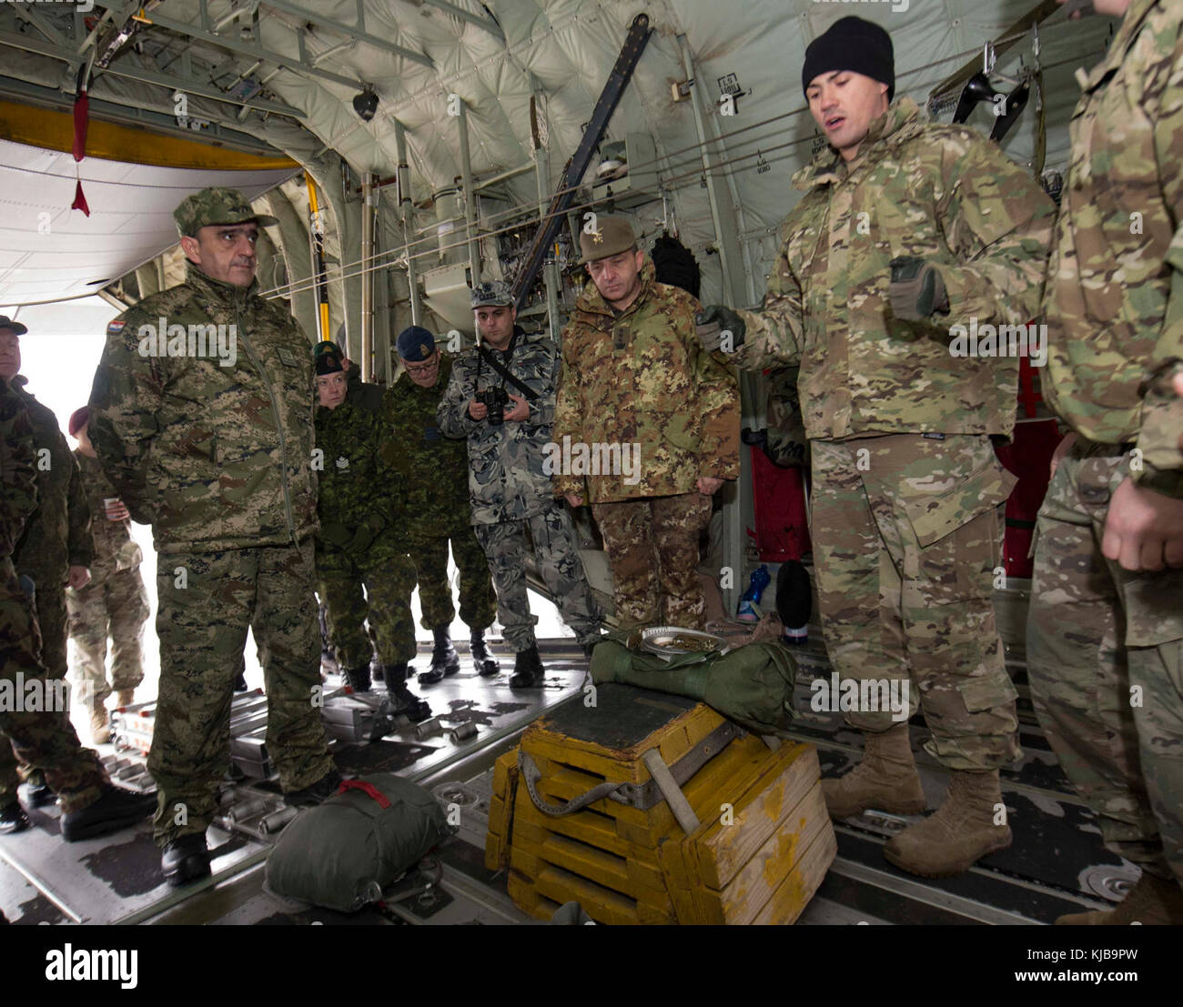 A Soldier, right, assigned to the 173rd Airborne Brigade, gives a ...
