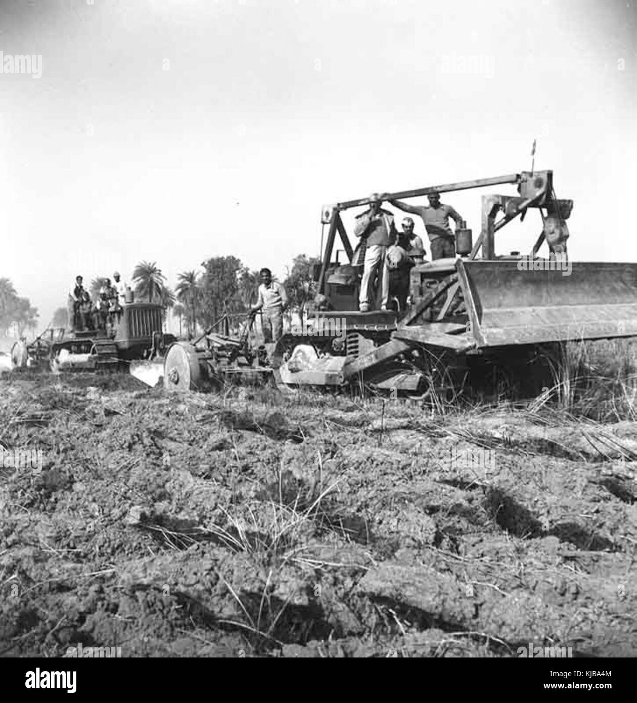 A photograph showing tractor use during the Latifpur land reclamation ...