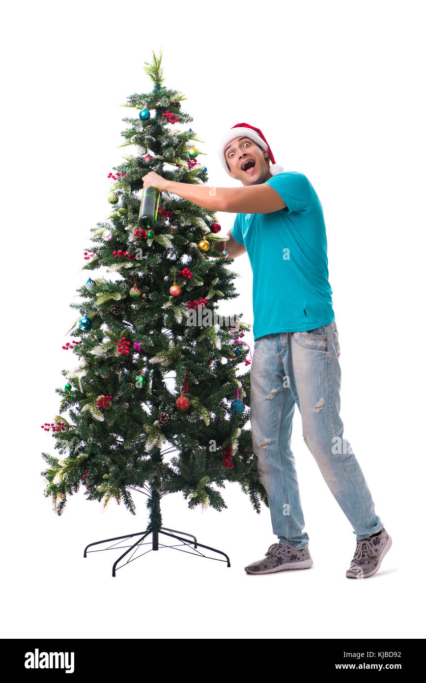 Young man decorating christmas tree isolated on white Stock Photo - Alamy