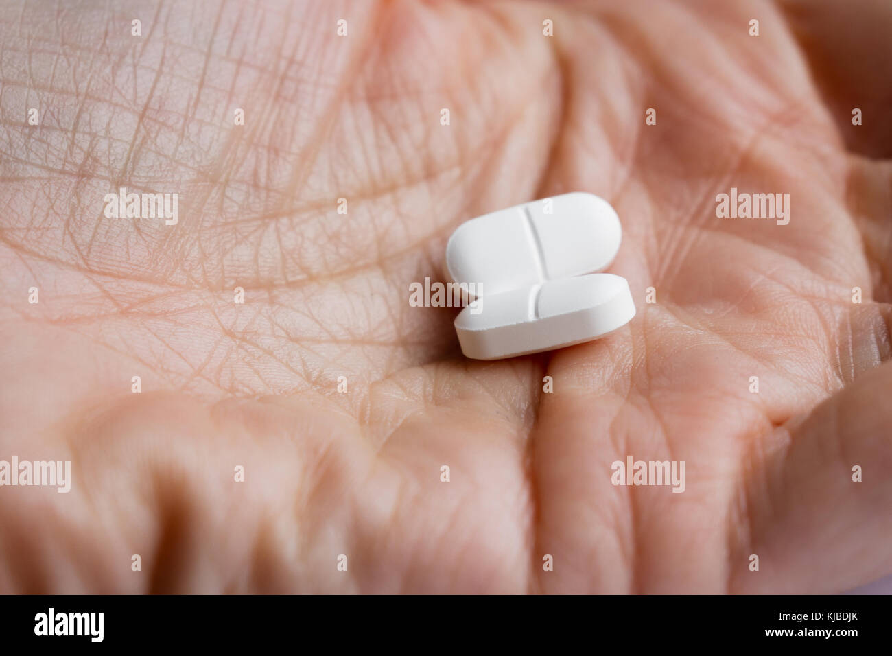 close up of two opioid tablets on a hand Stock Photo - Alamy