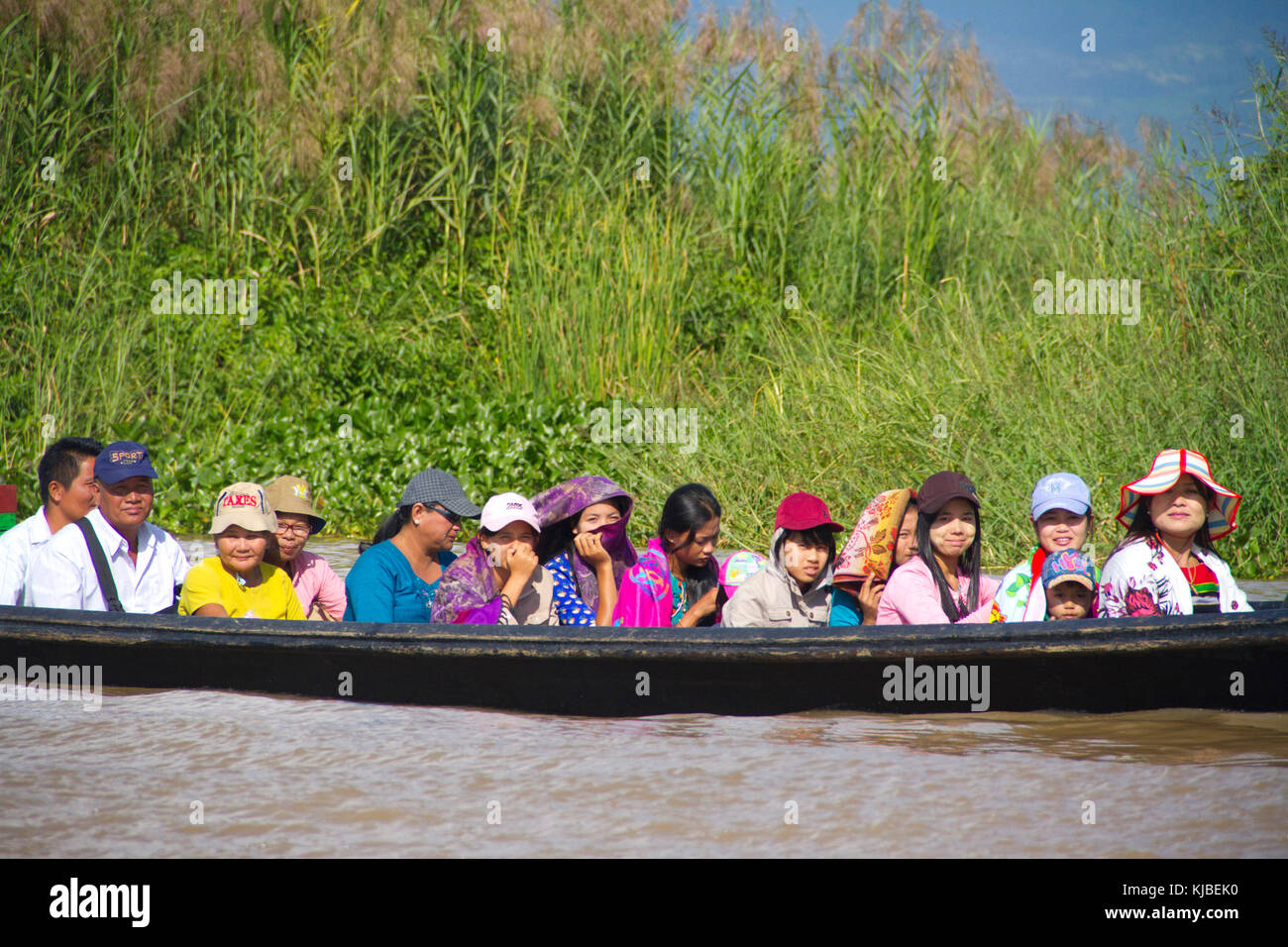 Tourists ride on motorboats across Inle Lake in Myanmar. Inle lake is a ...