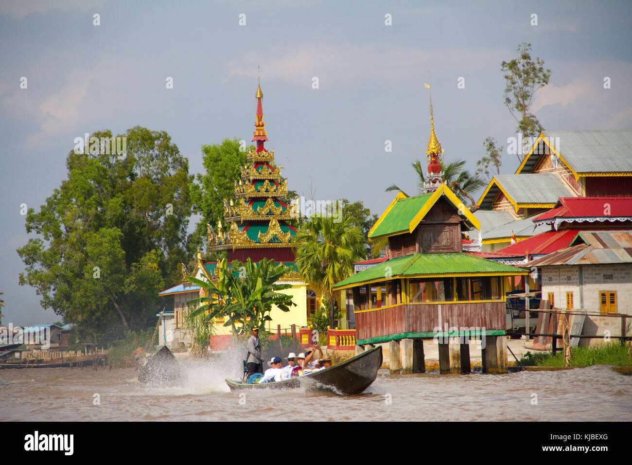 Tourists ride on motorboats across Inle Lake in Myanmar. Inle lake is a ...
