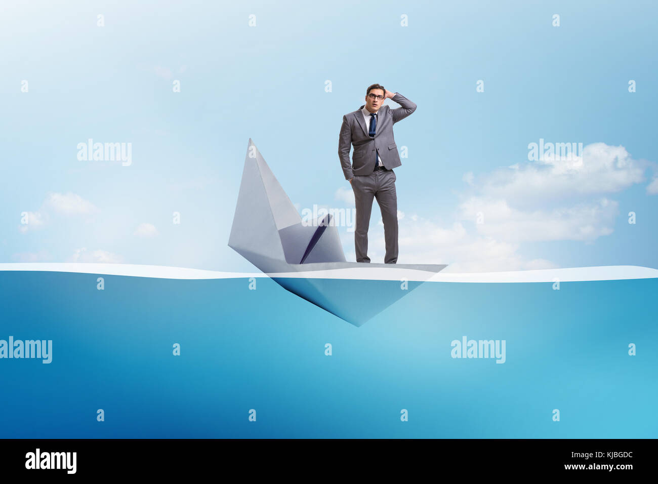 Businessman escaping sunken paper boat ship Stock Photo - Alamy