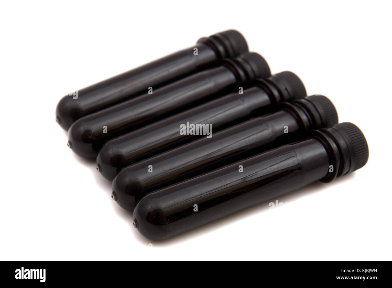 Five Pet Bottle Preforms on white background Stock Photo - Alamy