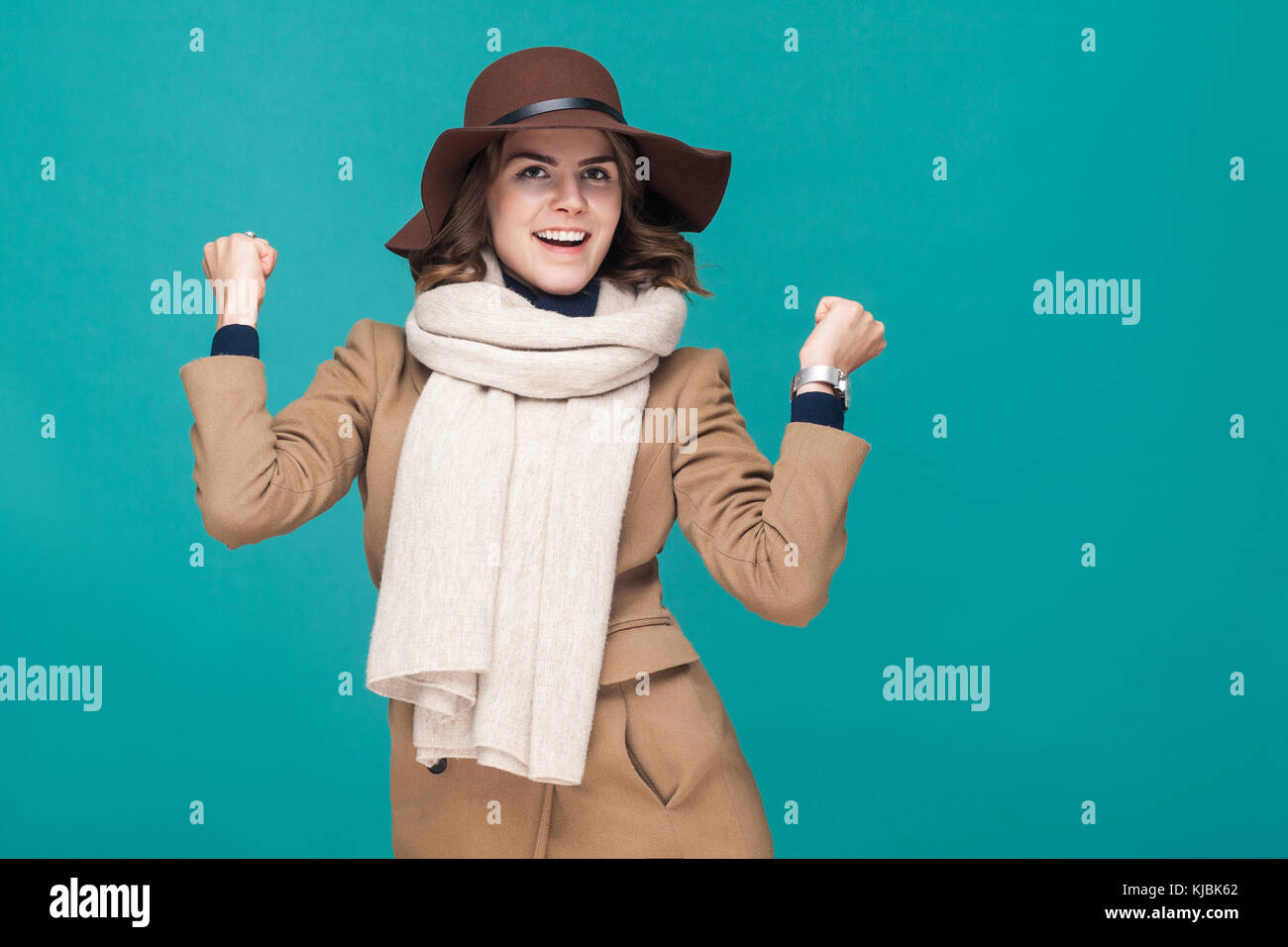 Yes! Gesture woman rejoicing her success. Win sign. Studio shot Stock ...