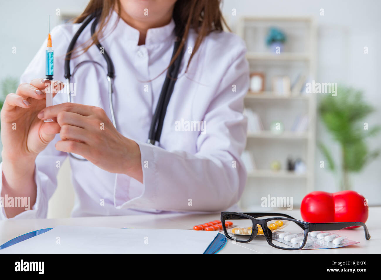 Doctor with syringe in the hospital Stock Photo - Alamy