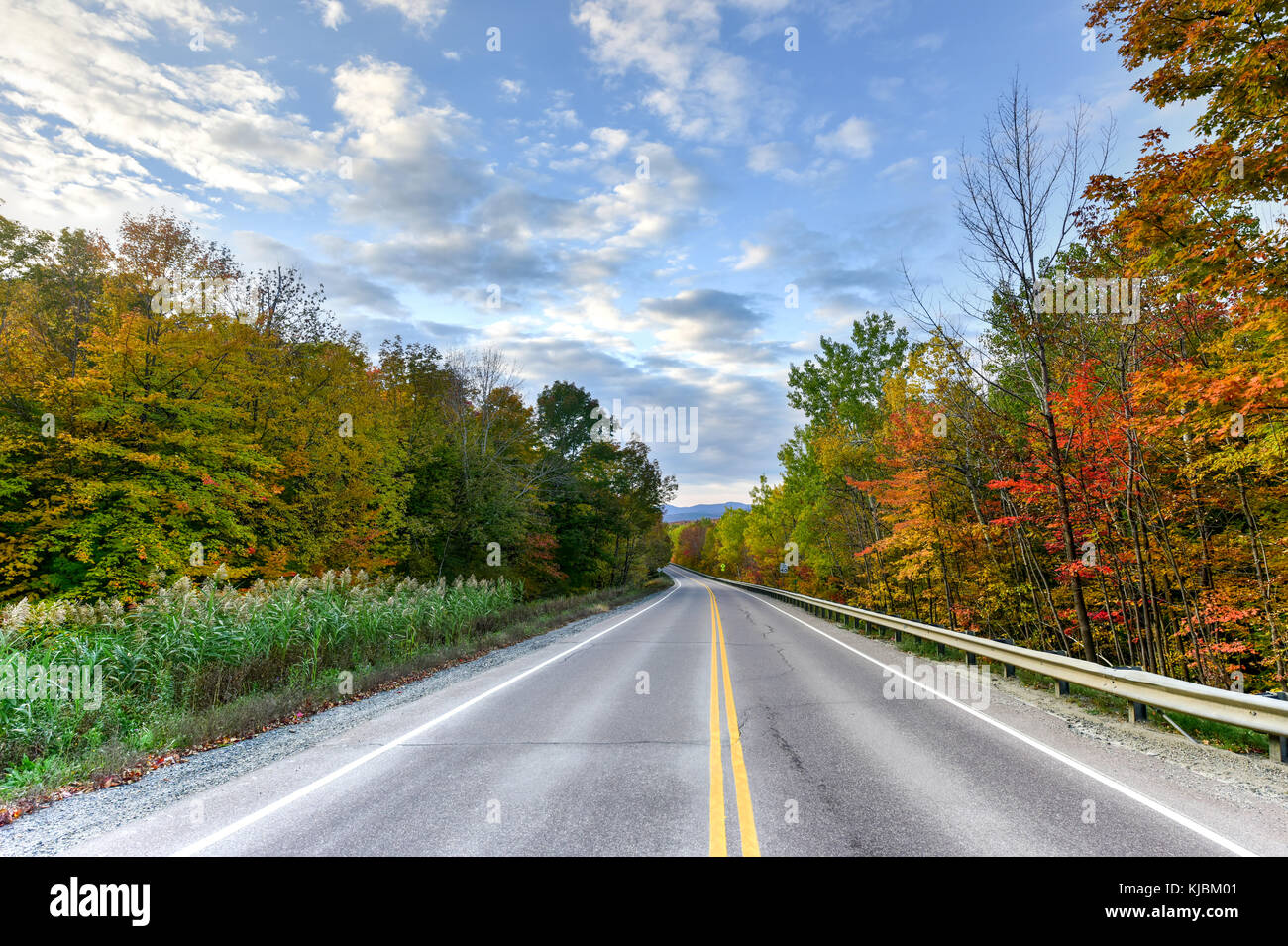 Peak fall foliage along the road through Smugglers Notch, Vermont Stock ...