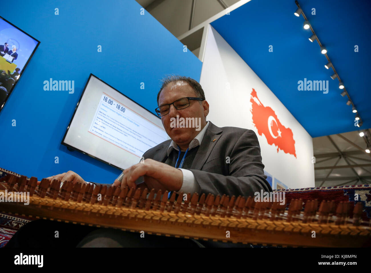 Turkish man plays qanun, traditional regional instrument at the COP23 ...