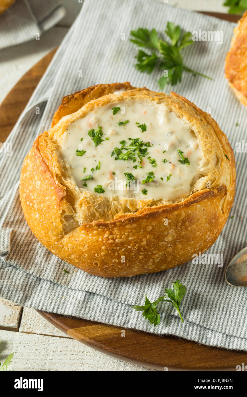 New England Clam Chowder in a Bread Bowl with Parsley Stock Photo - Alamy
