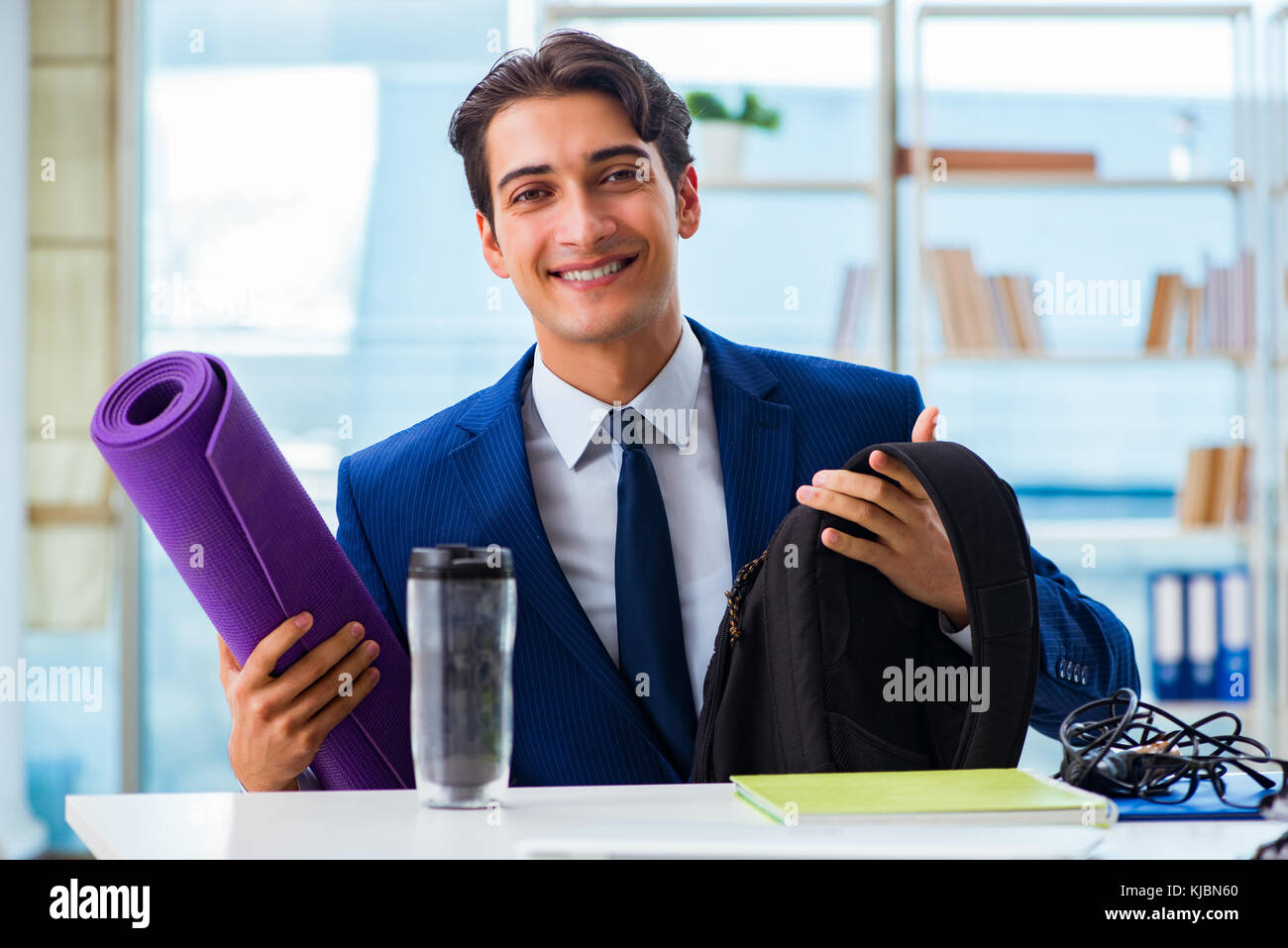 Man getting ready for sports break in the office Stock Photo - Alamy