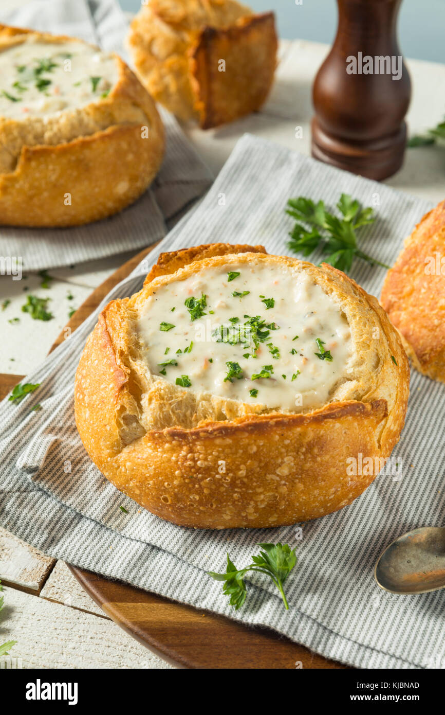 New England Clam Chowder in a Bread Bowl with Parsley Stock Photo - Alamy