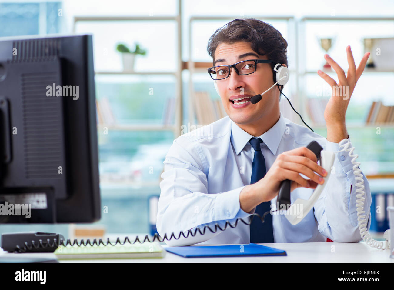 Call centre worker angry hi-res stock photography and images - Alamy