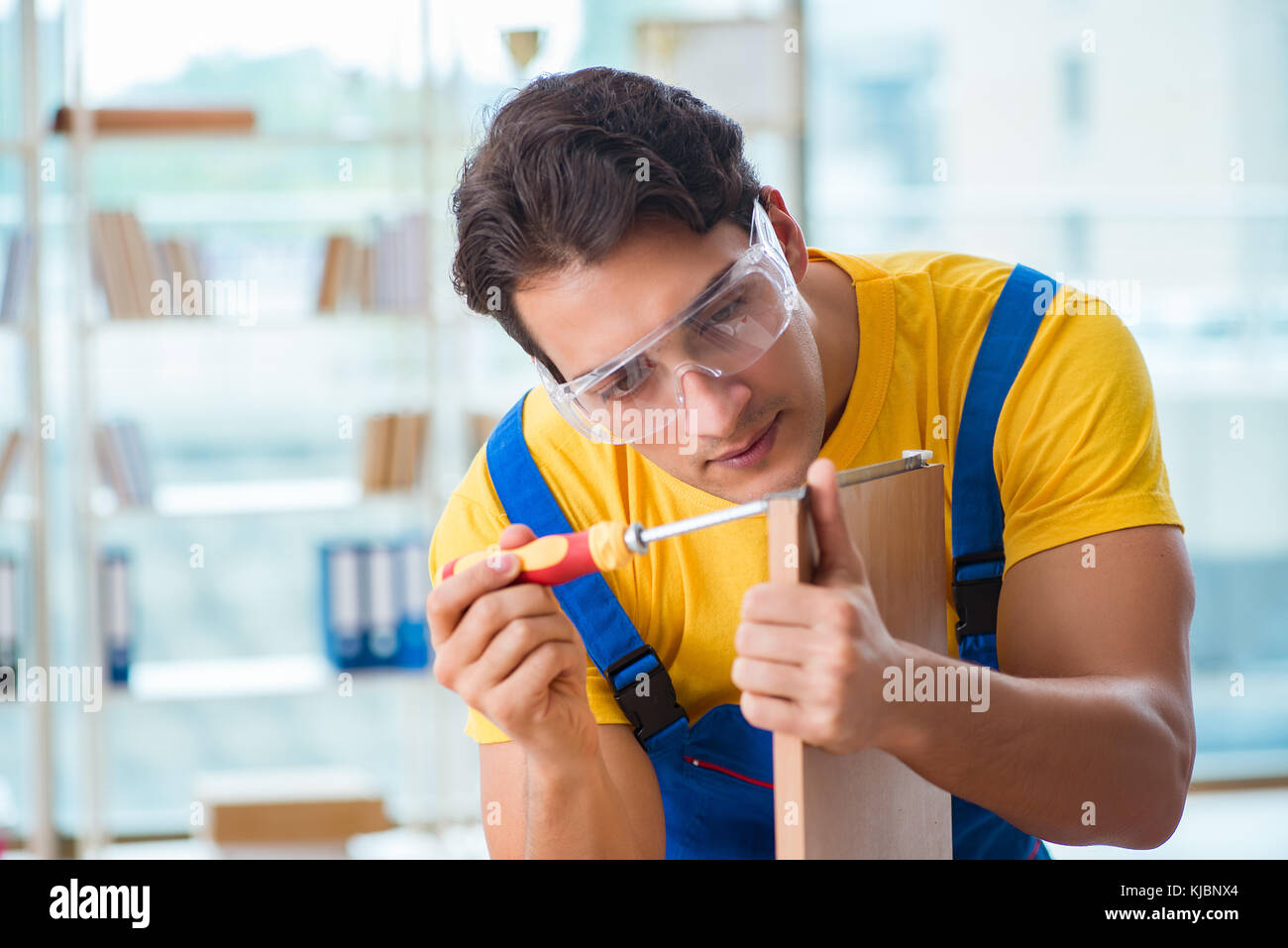 Furniture carpenter working in the workshop Stock Photo - Alamy