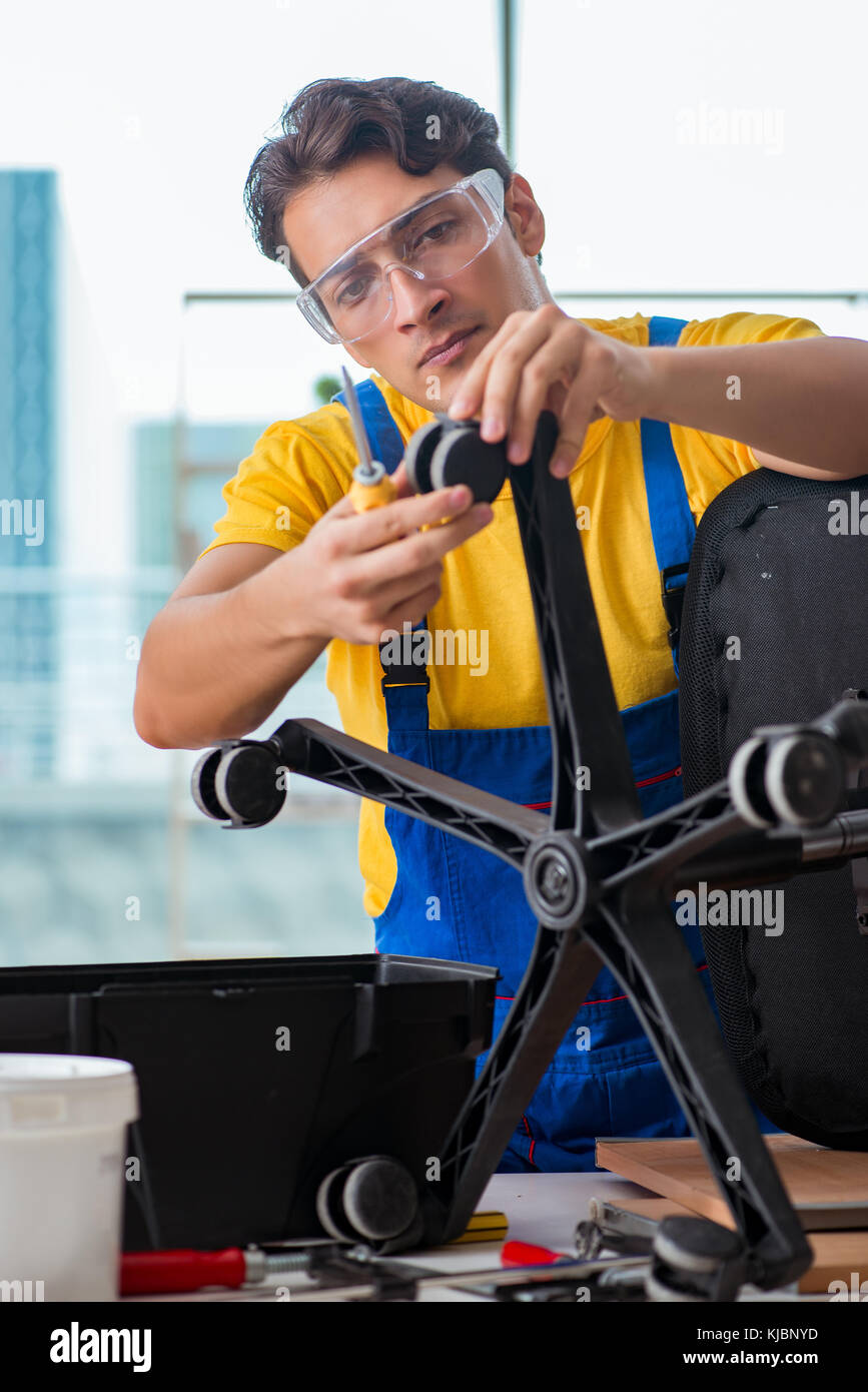 Furniture repairman working on repairing the chair Stock Photo - Alamy