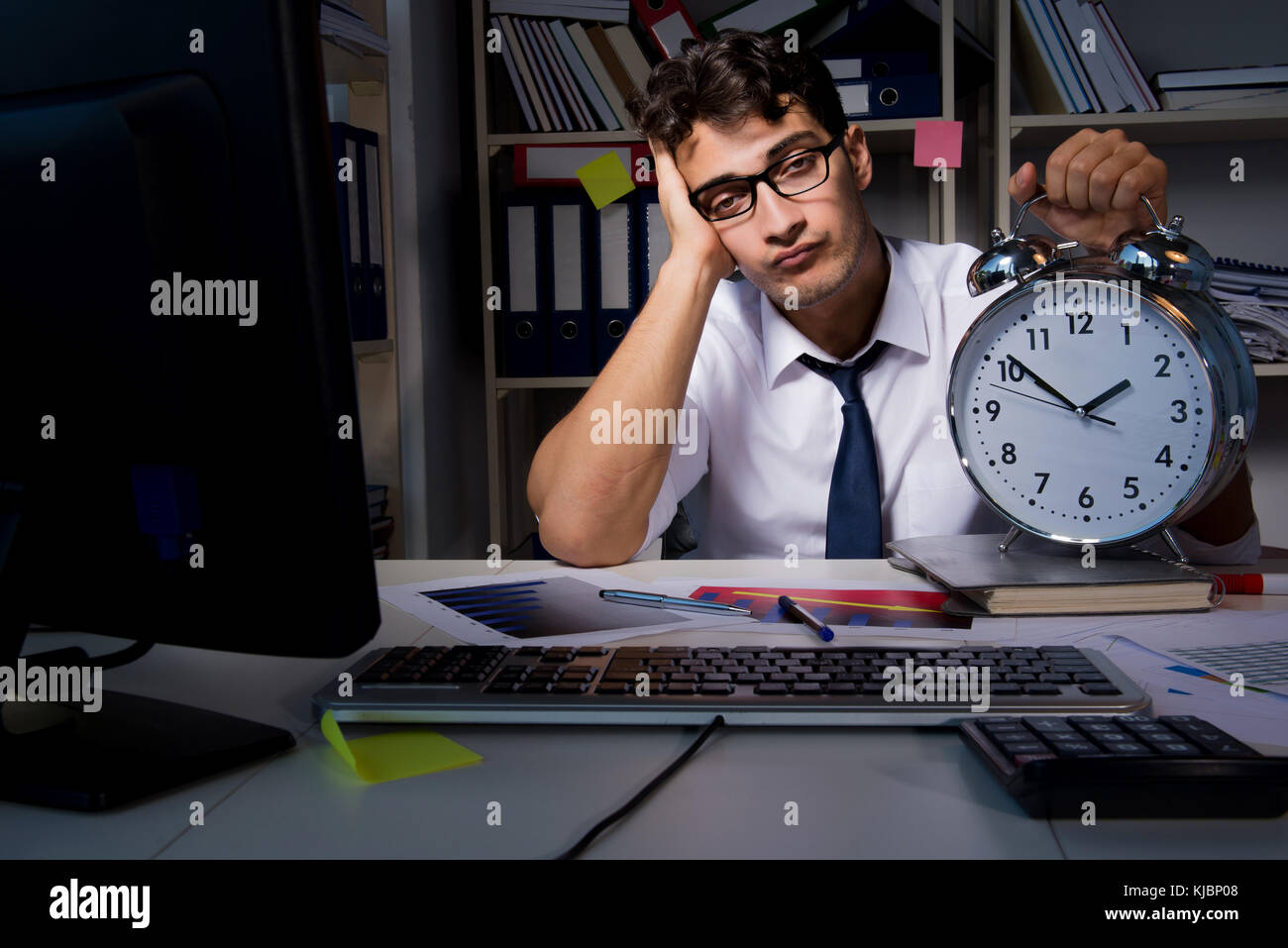 Man businessman working late hours in the office Stock Photo - Alamy