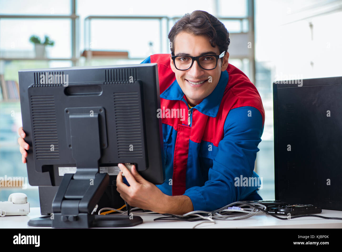 Computer repairman working on repairing computer in IT workshop Stock ...